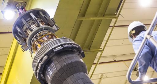 Hole in one: Technicians smoothly install the center stack in the NSTX ...